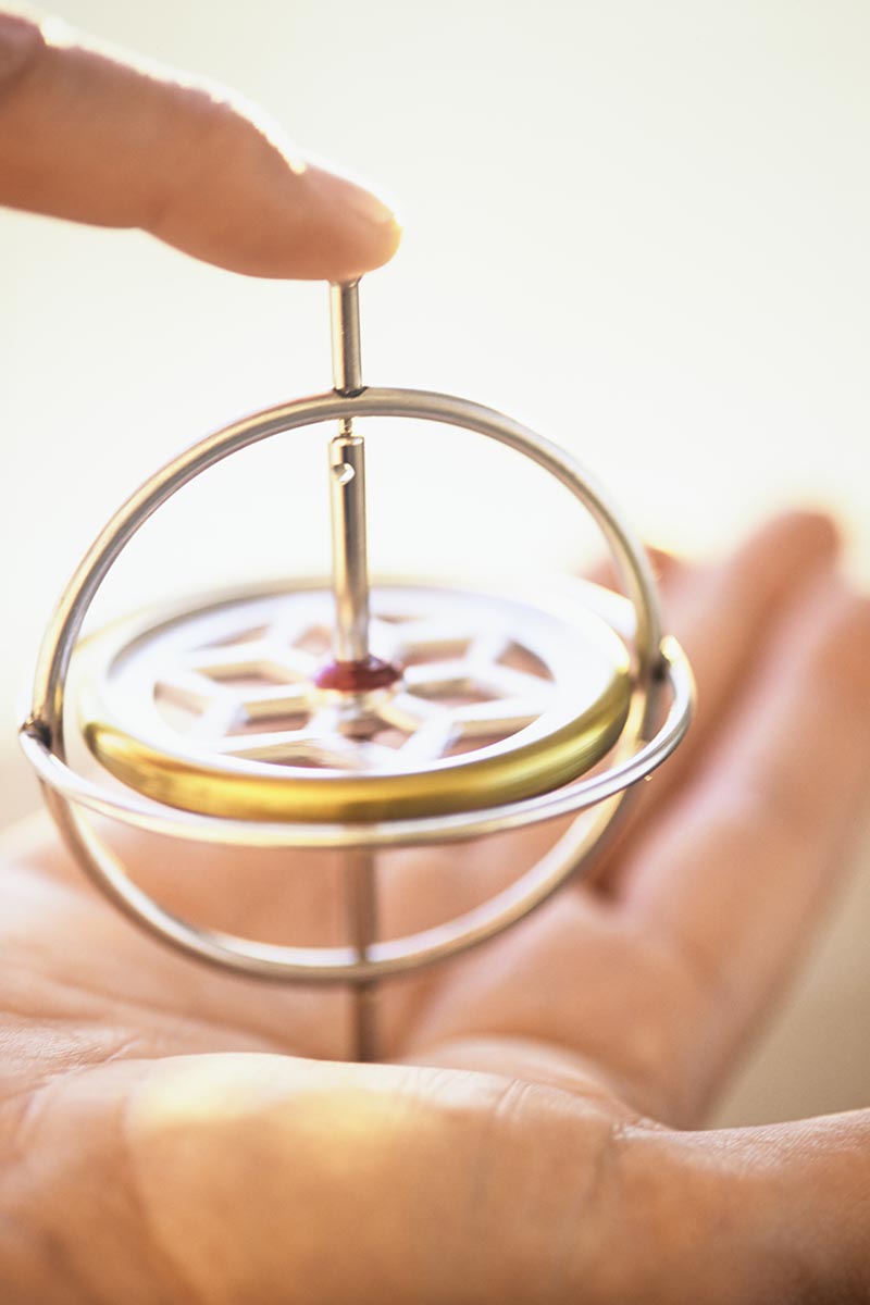 Man's hands balancing a gyroscope - StockFreedom - Premium Stock ...