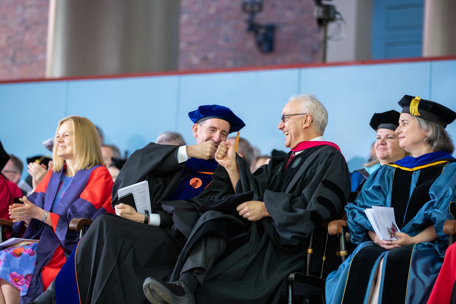 Francis Doyle - George Daley Fist Bump | News | The Harvard Crimson