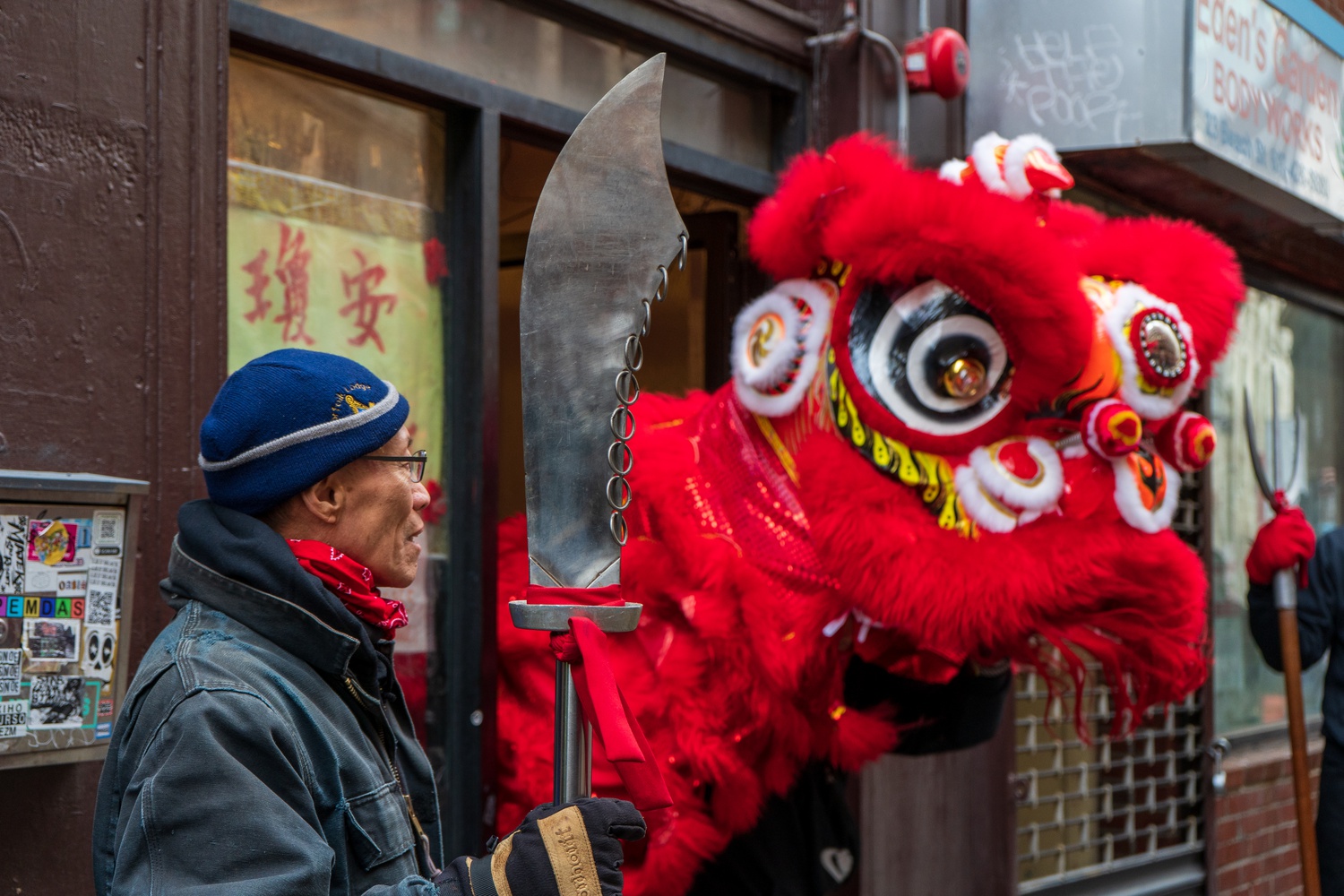 Performer Holds Dao Next to Lion | Multimedia | The Harvard Crimson