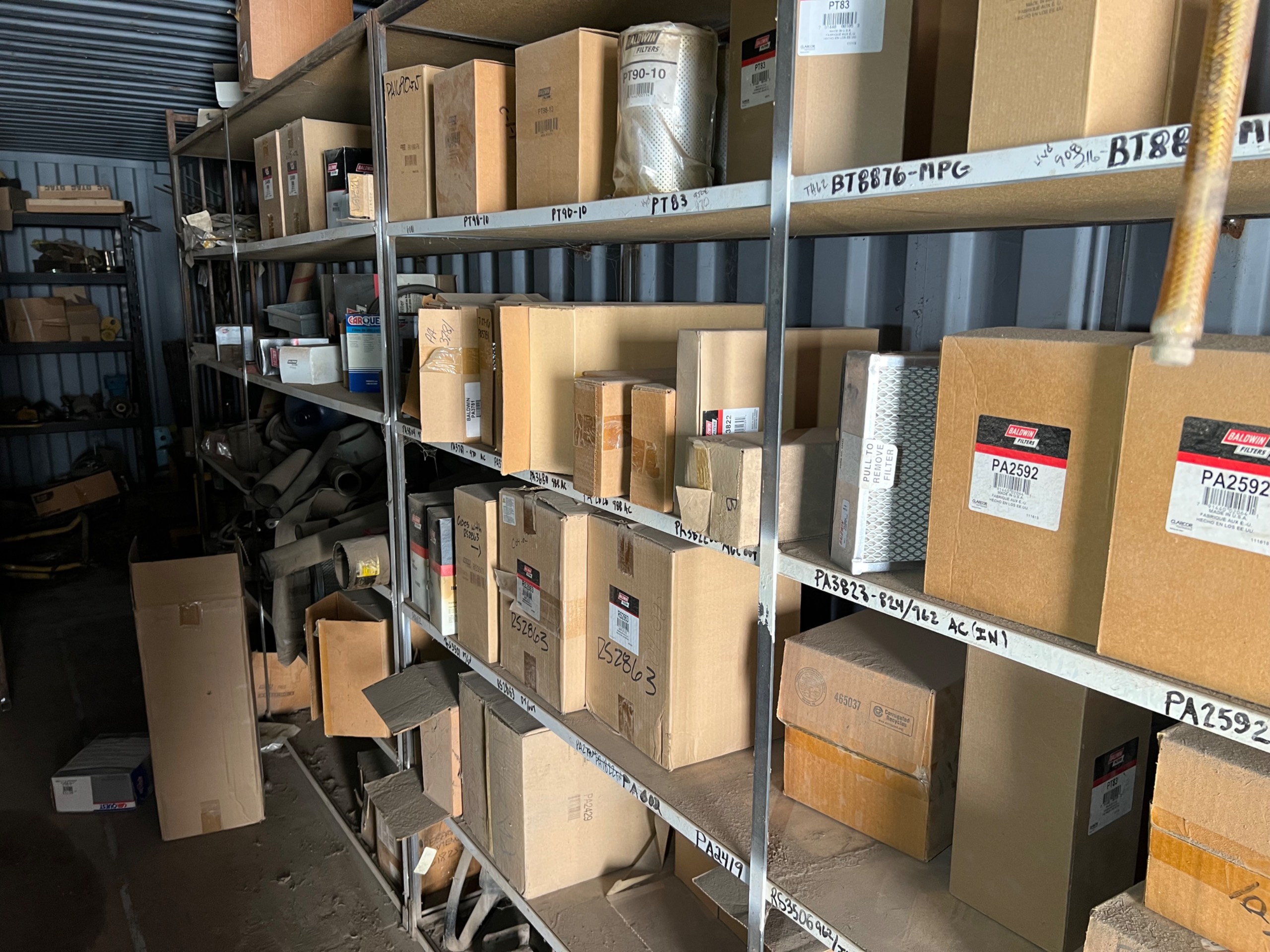 CONTAINER OF HEAVY EQUIPMENT PARTS