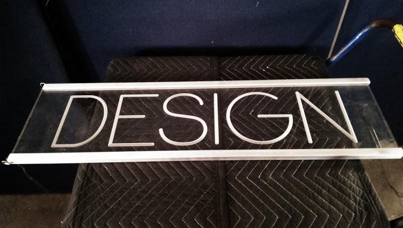 Lot #57: Etched Glass LED Edge Lit "Design" Sign - WireBids