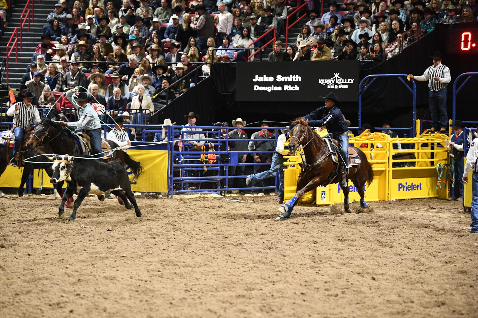 Smith, Rich Get NFR 2025 Round 2 Win - The Team Roping Journal