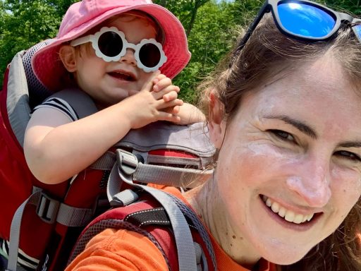 Sabrina Little carrying her child – iRunFar