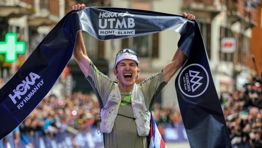 2025 UTMB - Tom Evans - finish banner - feature – iRunFar