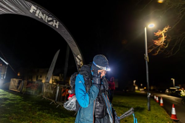 Anna Troup - 2026 Winter Spine Race - women's winner at finish – iRunFar
