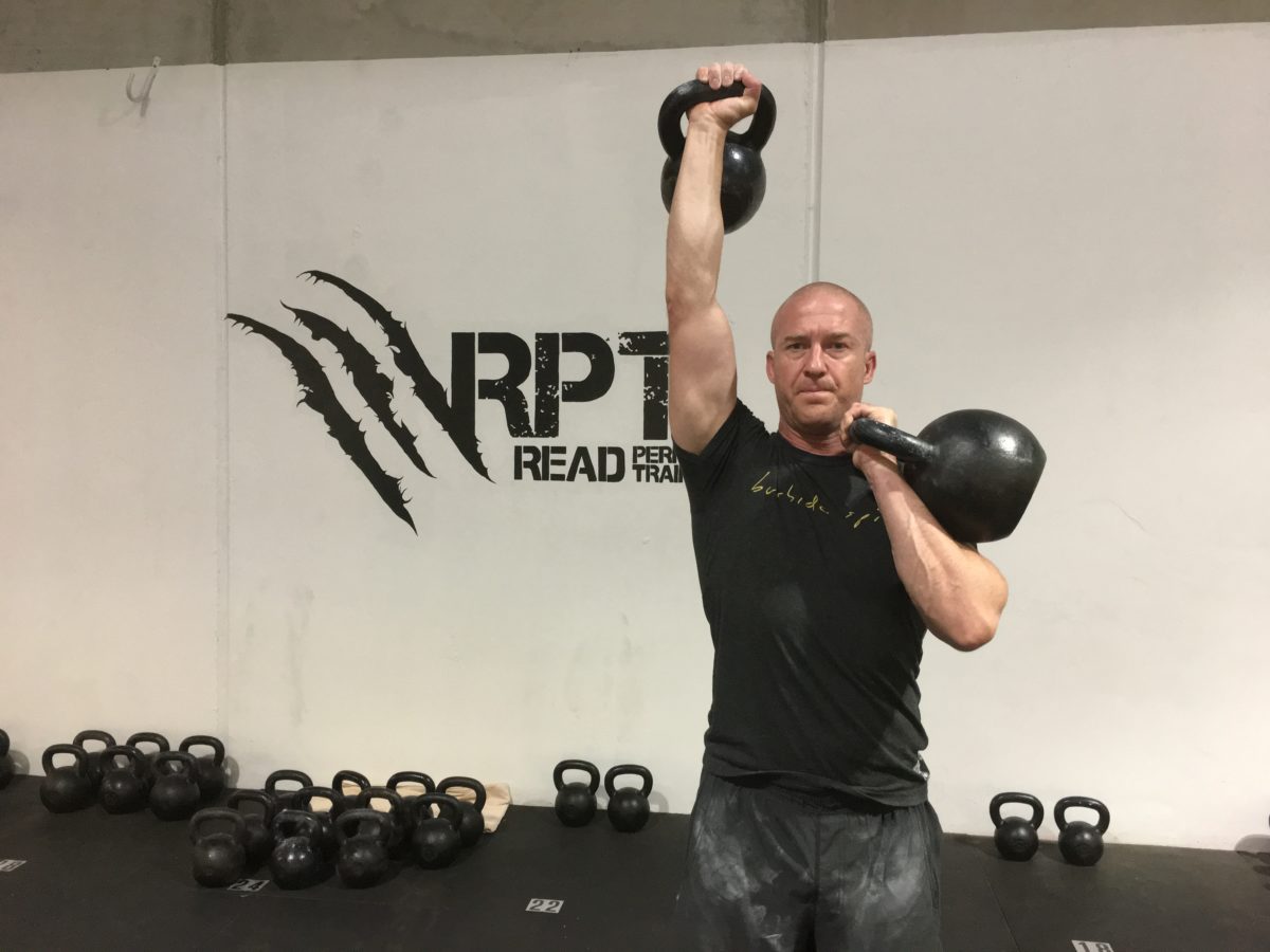 KB-rack-OH-carry-Complete-human-performance - Old City CrossFit